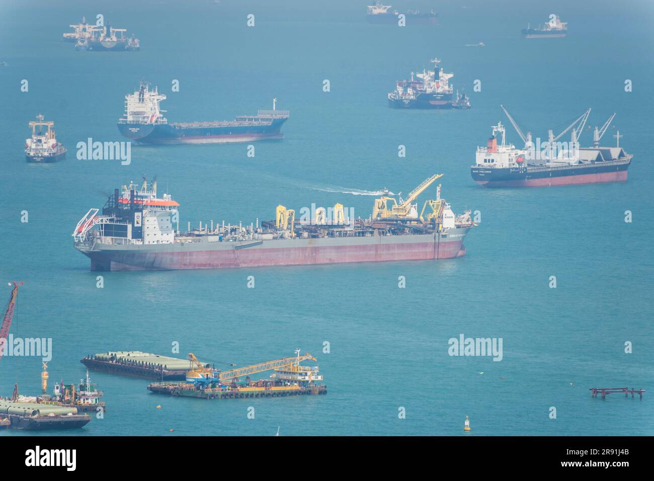 Container ships waiting to dock at off the coast of Singapore Stock Photo - Alamy