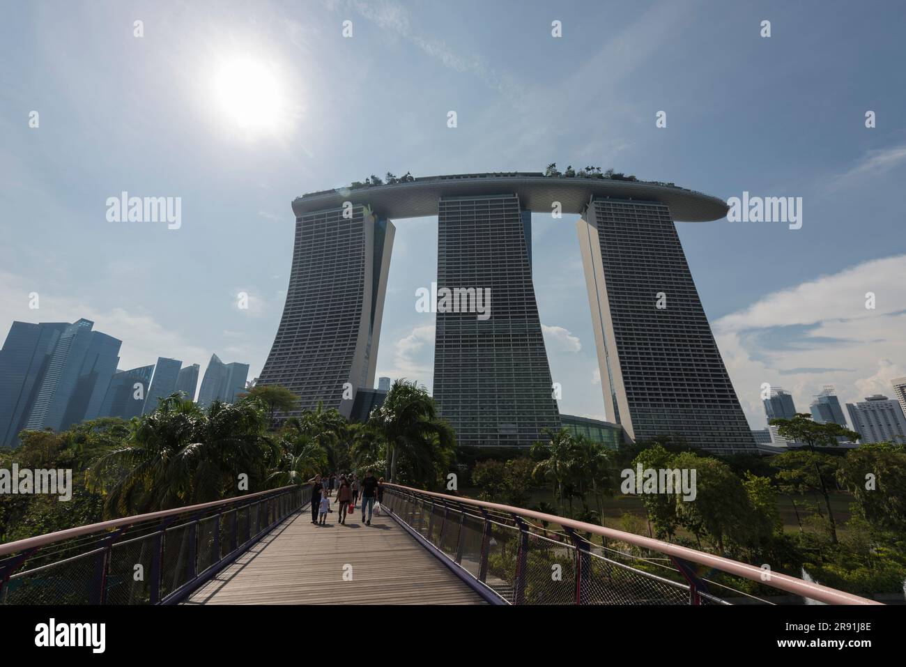 A pedestrian footbridge and modern architecture in Singapore Stock ...