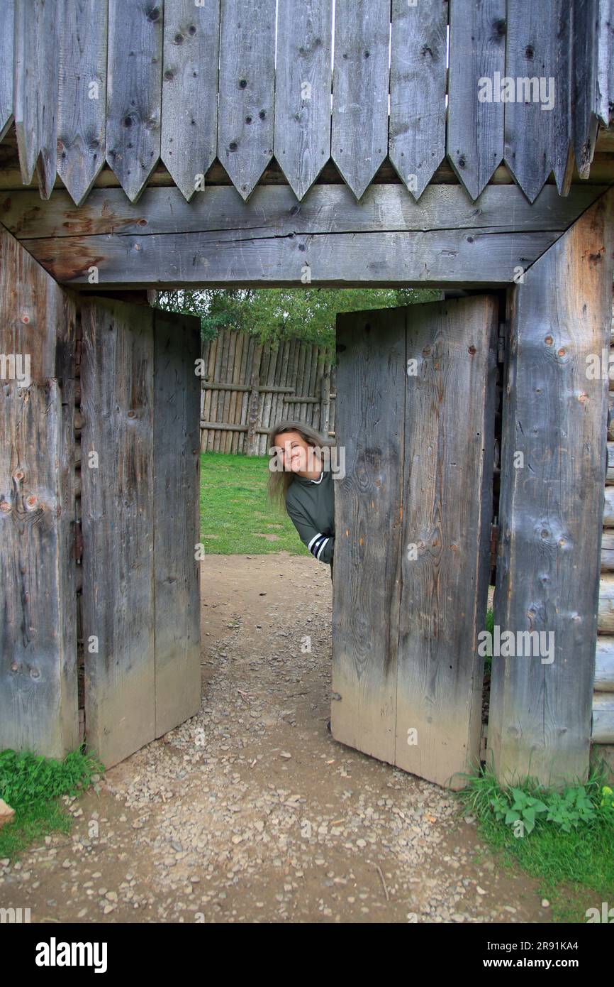 Girl by wooden gate hi-res stock photography and images - Alamy