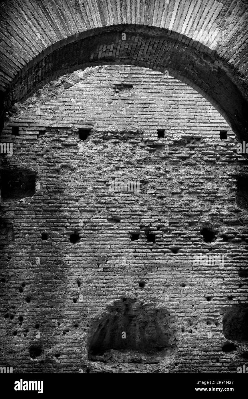 Black and white gritty image of the ruined wall of the Colosseum in ...