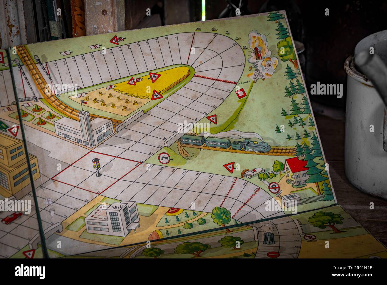 Old table game with small wooden cars on old quality color cardboard ...