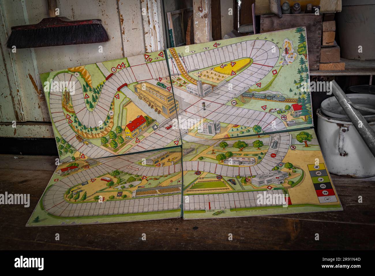 Old table game with small wooden cars on old quality color cardboard ...