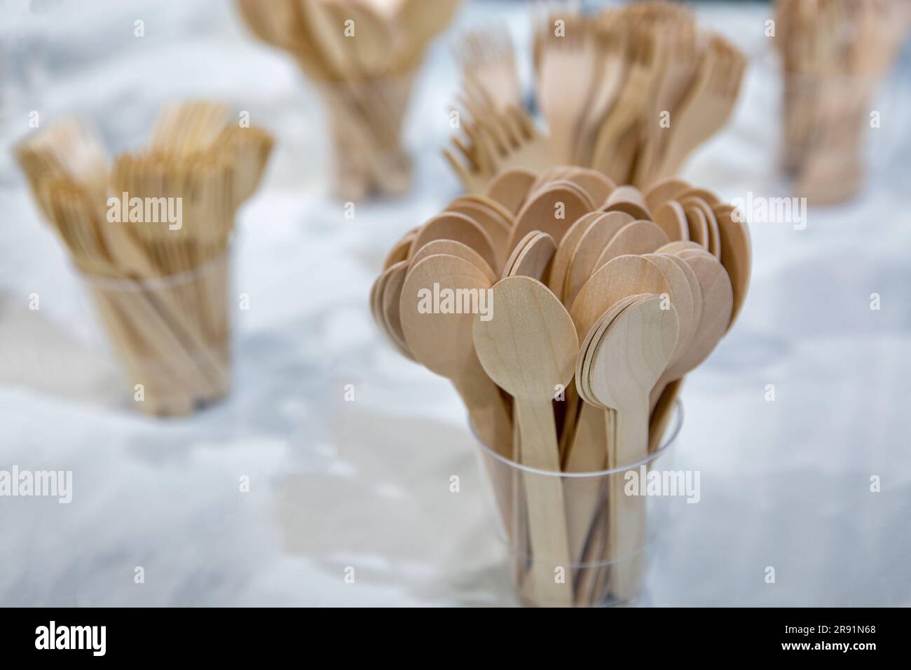 Disposable wooden spoons and forks for fast food closeup. Eco-friendly ...