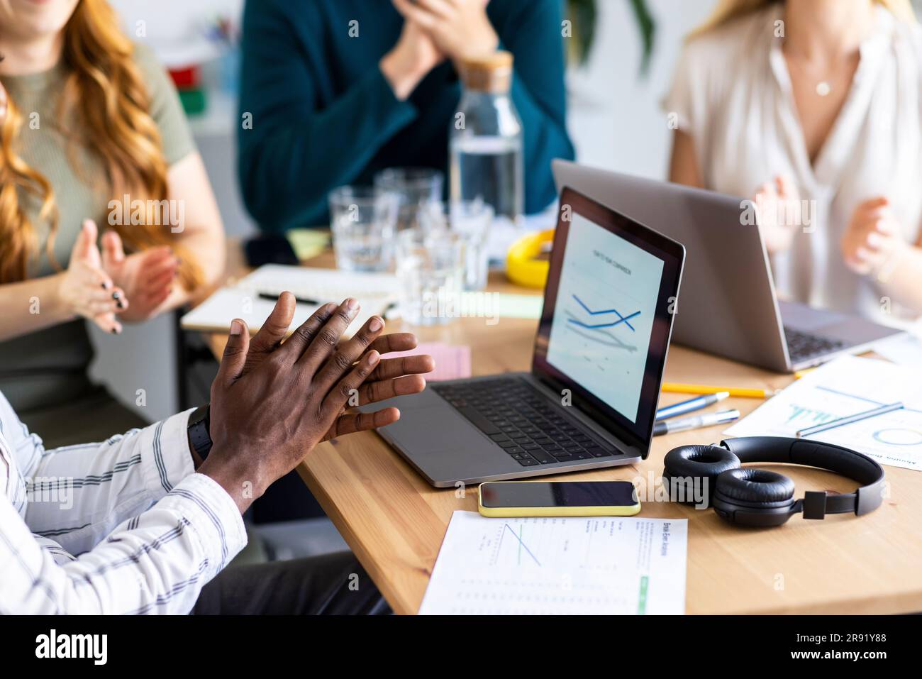 Clapping female hands in foreground hi-res stock photography and images ...