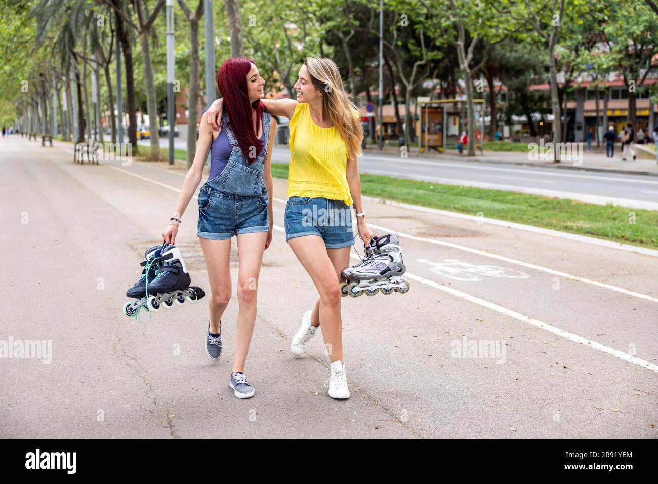 Smiling friends with arm around road hi-res stock photography and ...