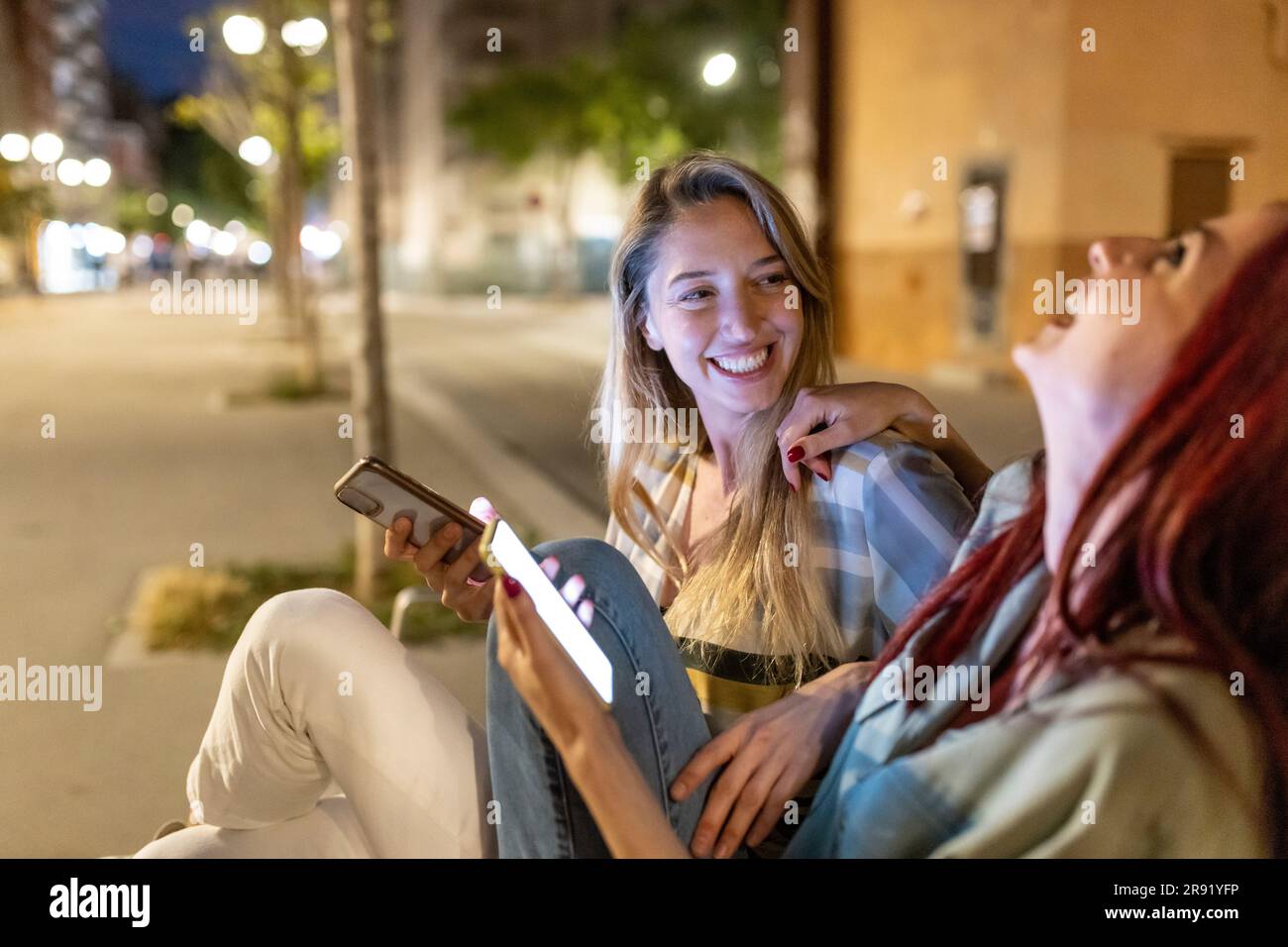 Cheerful friends having fun night hi-res stock photography and images ...