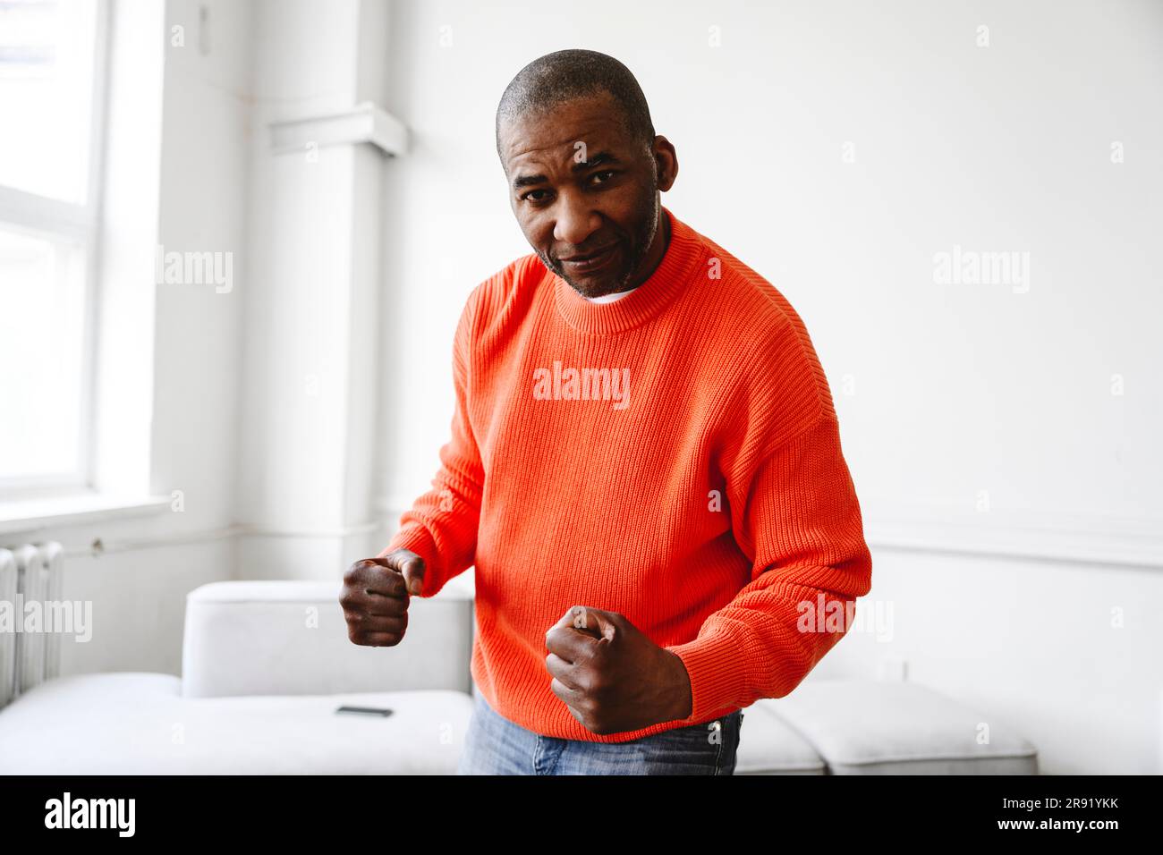 Man clenching fist hi-res stock photography and images - Alamy