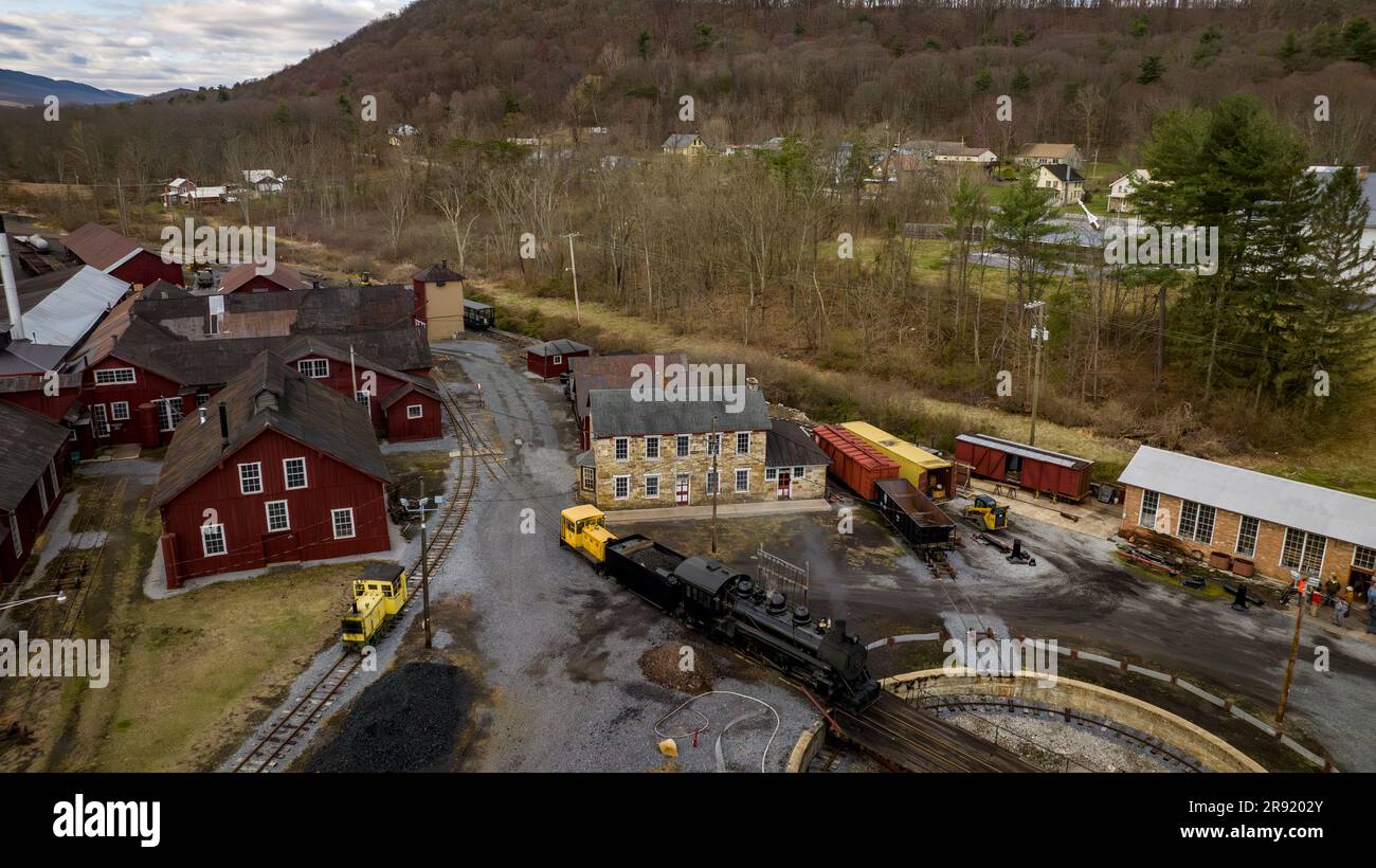 An Aerial View of a Narrow Gauge Steam Engine Complex, With Roundhouse ...