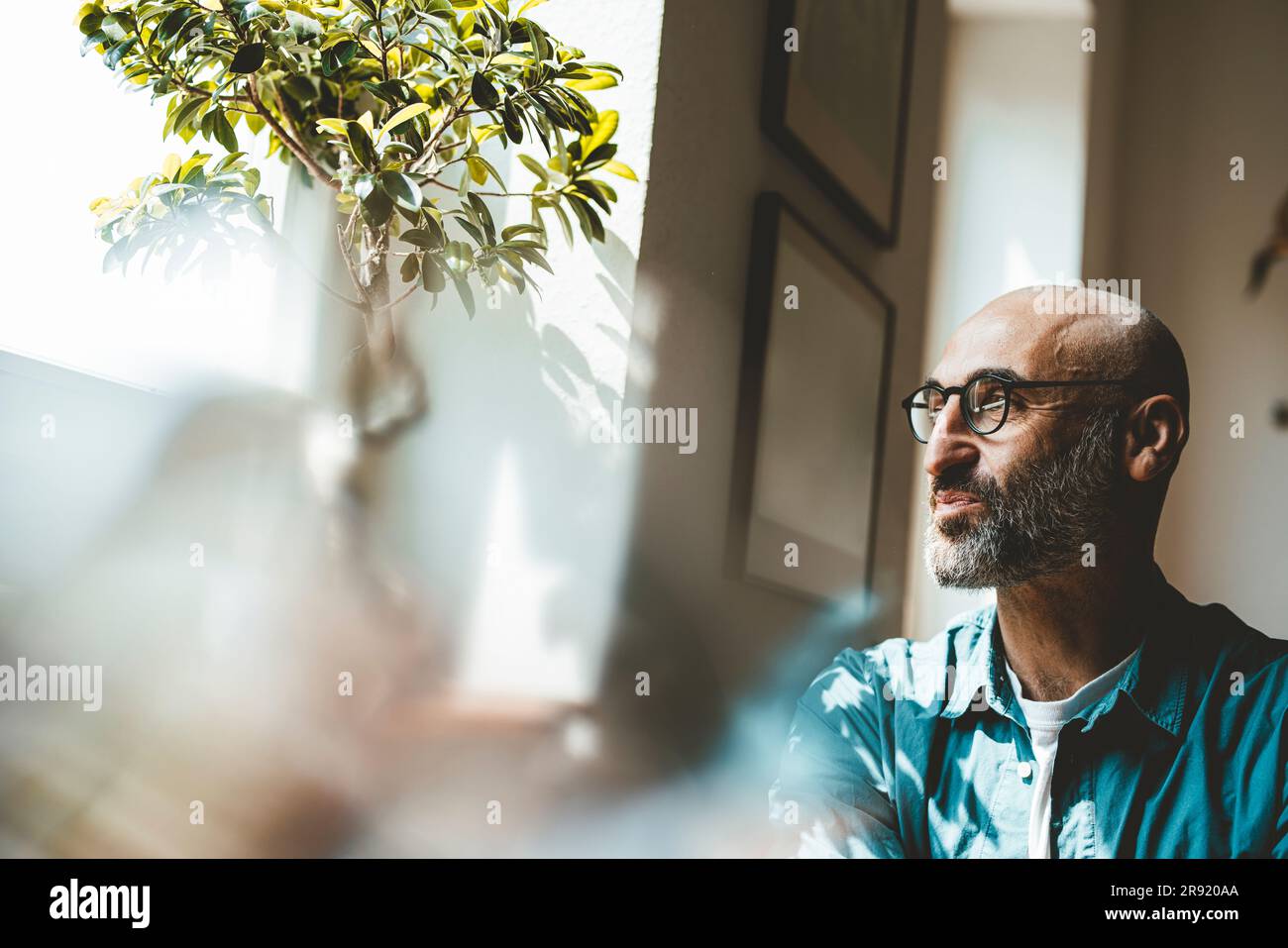 Man looking window home hi-res stock photography and images - Alamy