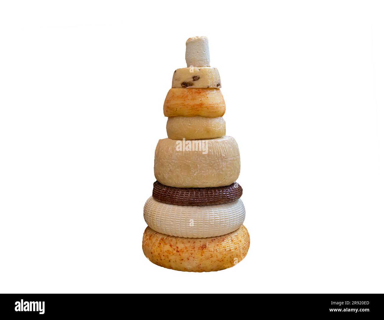 An artfully arranged stack of cheese wedges, featuring a variety of ...