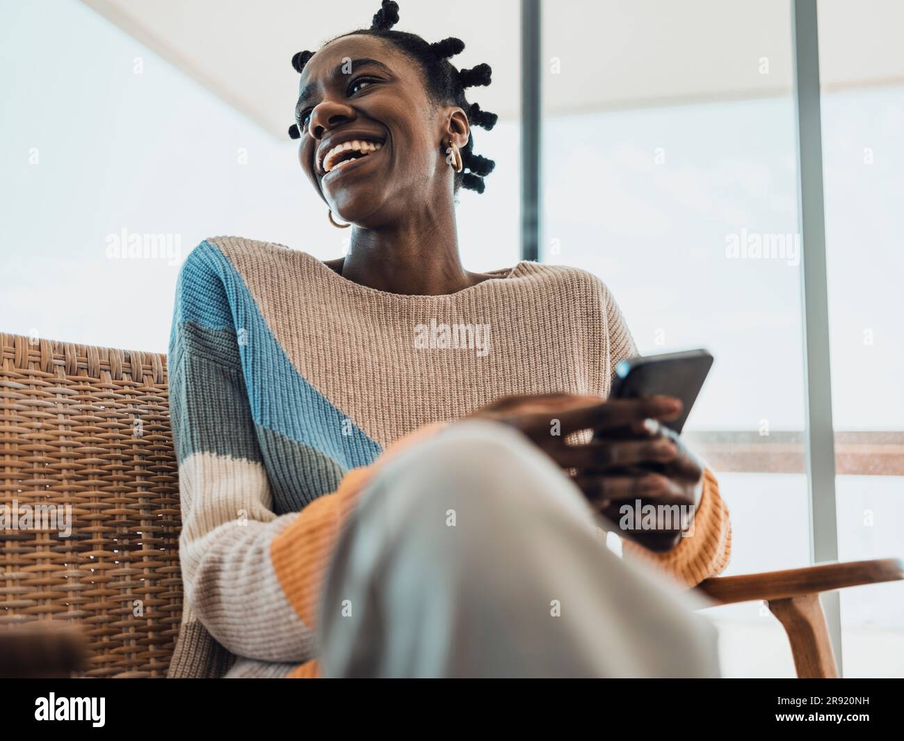 Woman holding smartphone low angle hi-res stock photography and images ...