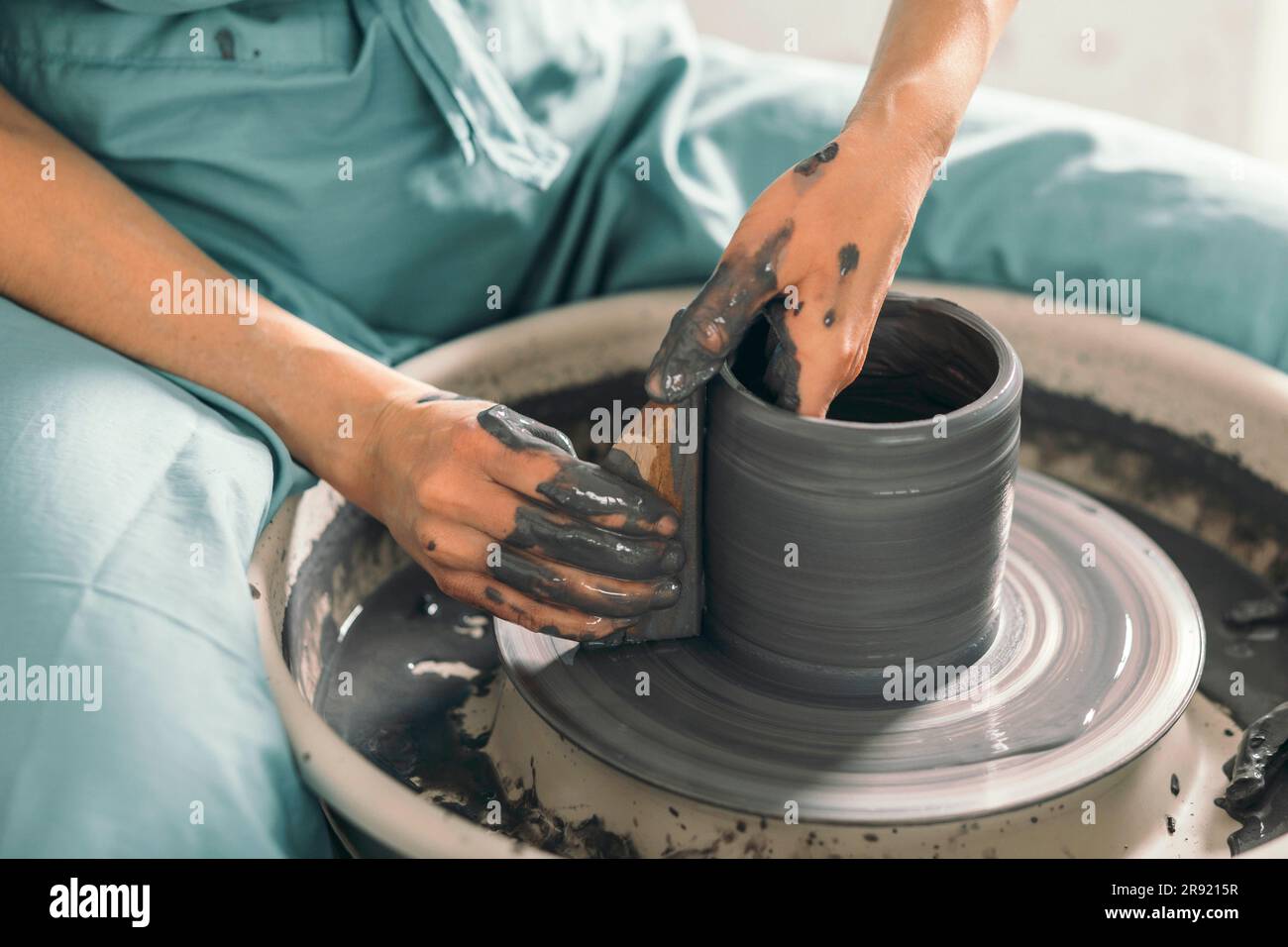 Hands of potter shaping ceramic pot at workshop Stock Photo - Alamy