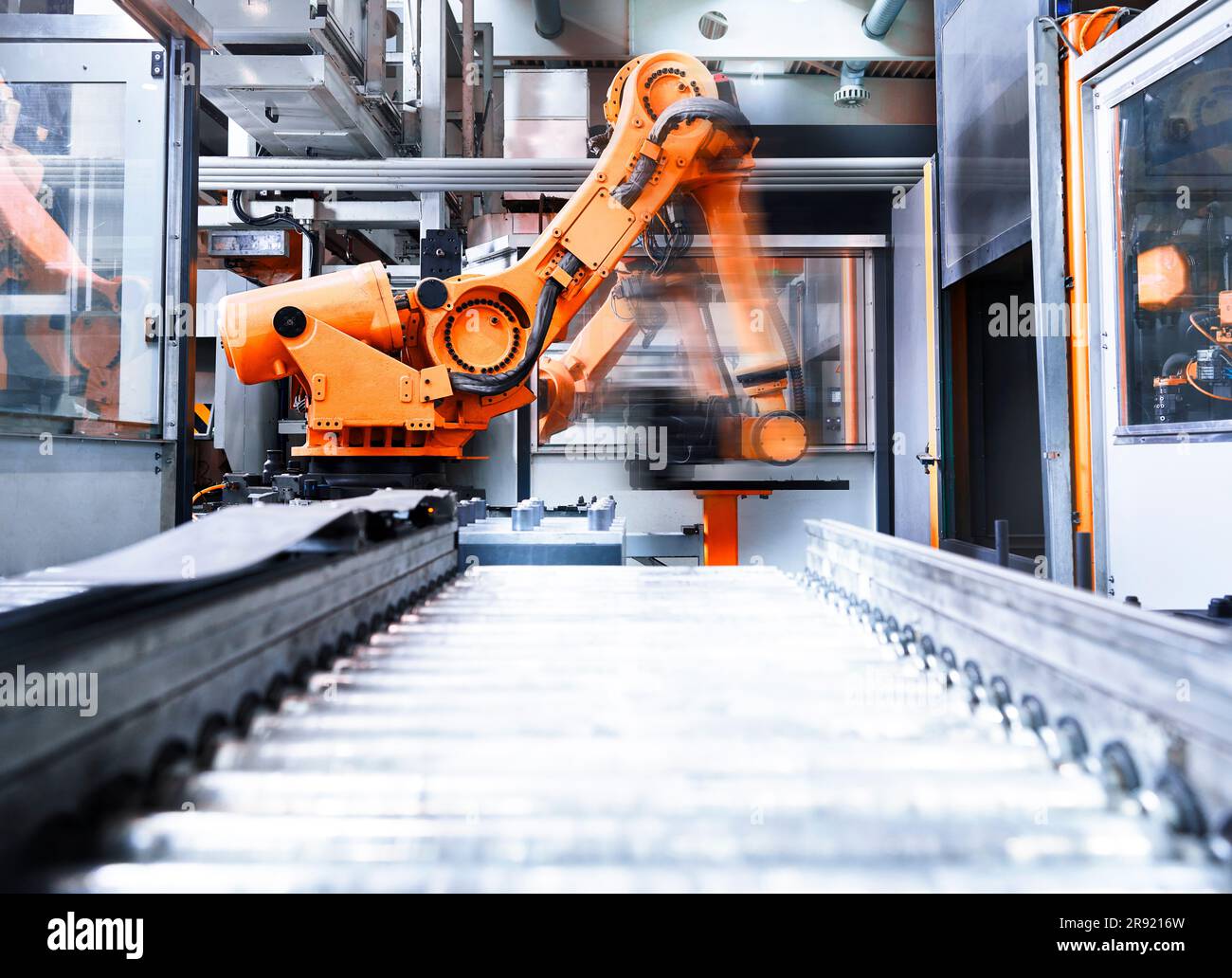 Blurred motion of robotic arm in factory Stock Photo - Alamy