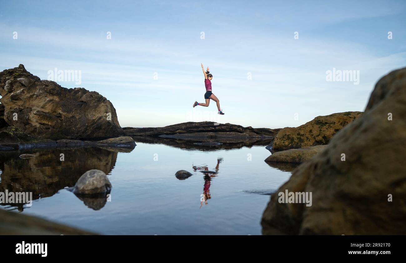 Woman rocks jump hi-res stock photography and images - Alamy