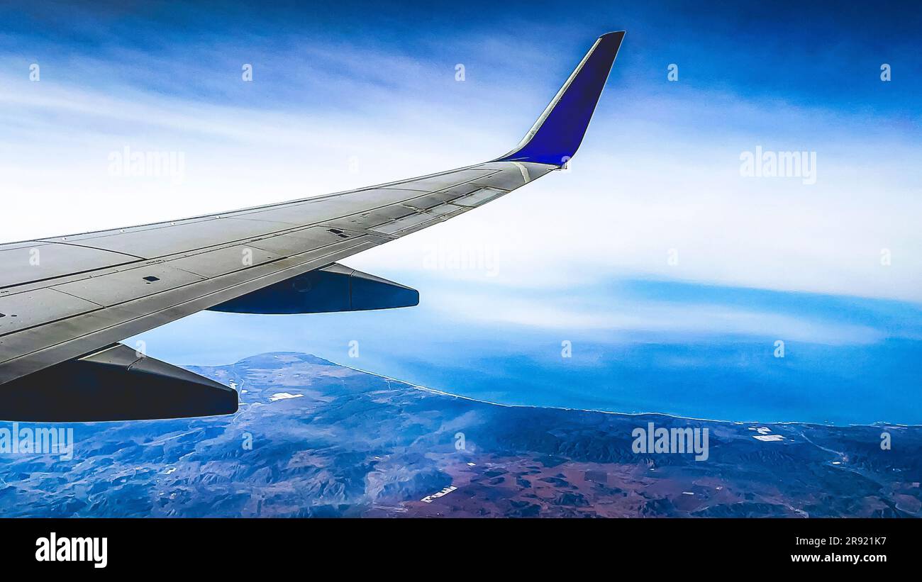 Airplane flying over the Sea of Cortez and the Pacific Ocean, in the ...