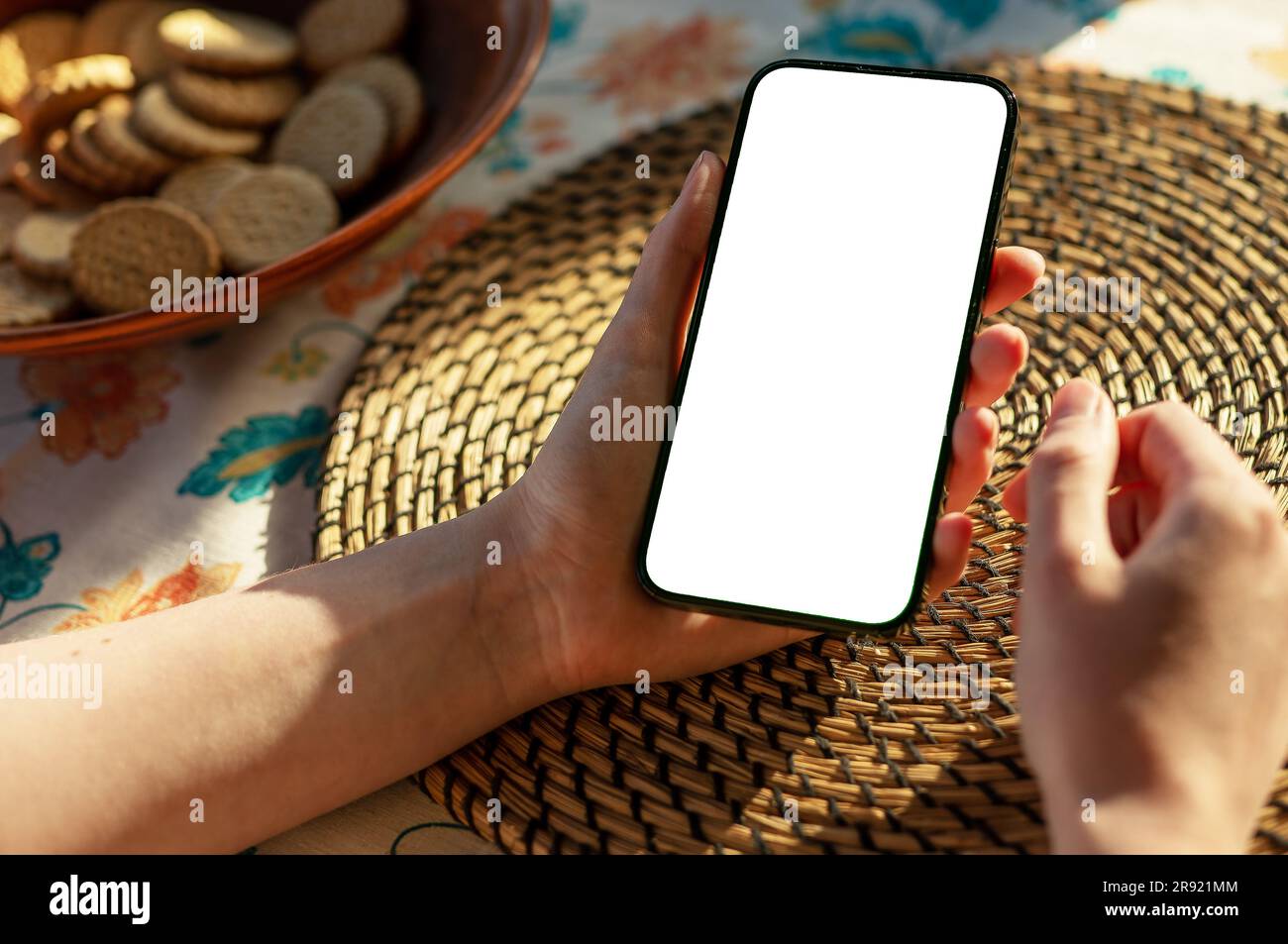 Hand using mobile phone screen mockup at dinner table, ordering food ...