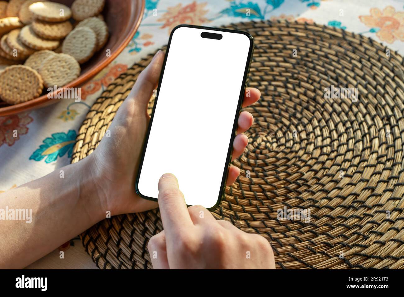 Hand using mobile phone screen mockup at dinner table, ordering food ...
