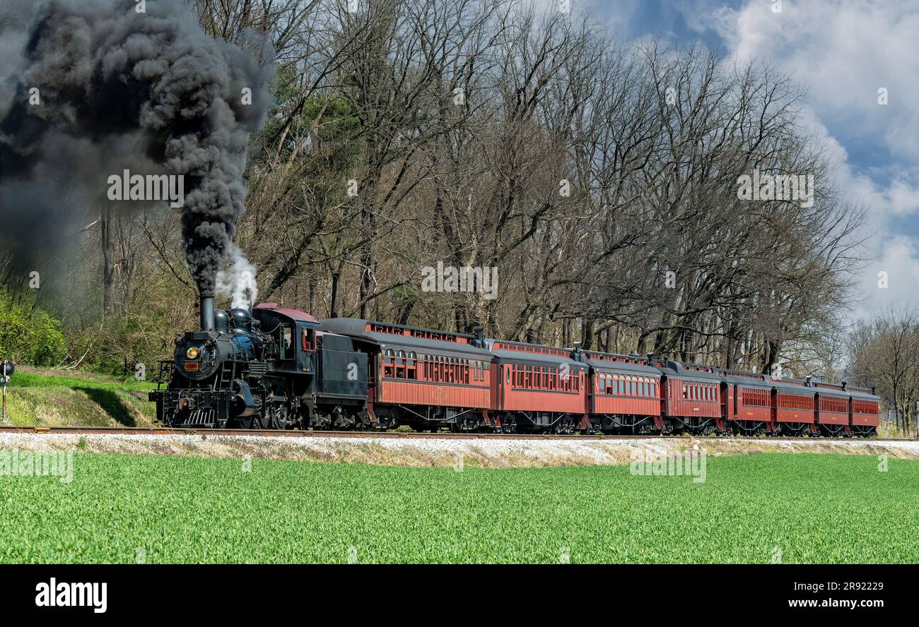 An Angled View of a Restored Steam Passenger Train Moving Slowly ...