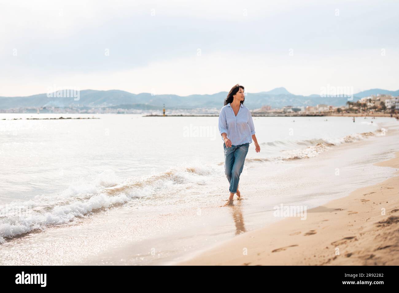 Mature woman walking near hi-res stock photography and images - Alamy