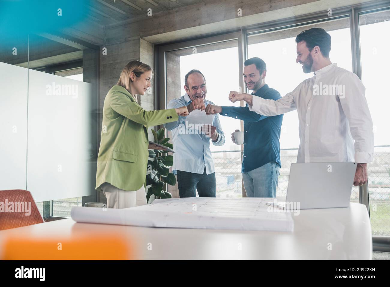 Coworkers fist bump hi-res stock photography and images - Alamy