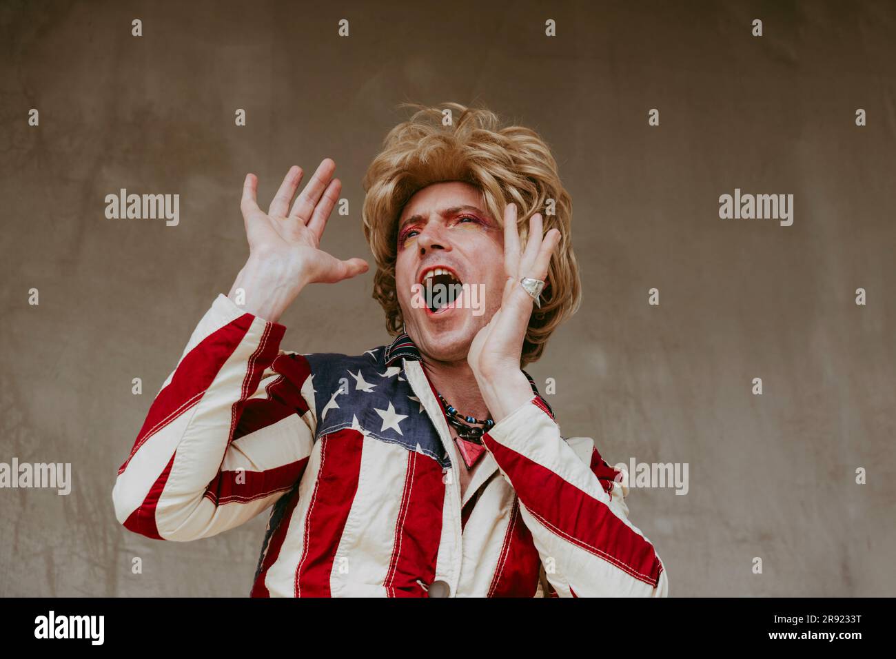 Carefree drag queen screaming in front of wall Stock Photo - Alamy