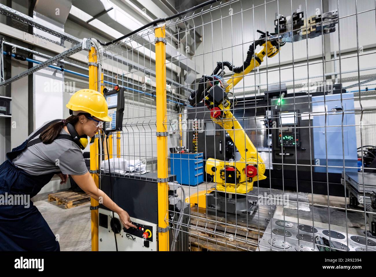 Female engineer checking maintenance robot hi-res stock photography and images - Alamy