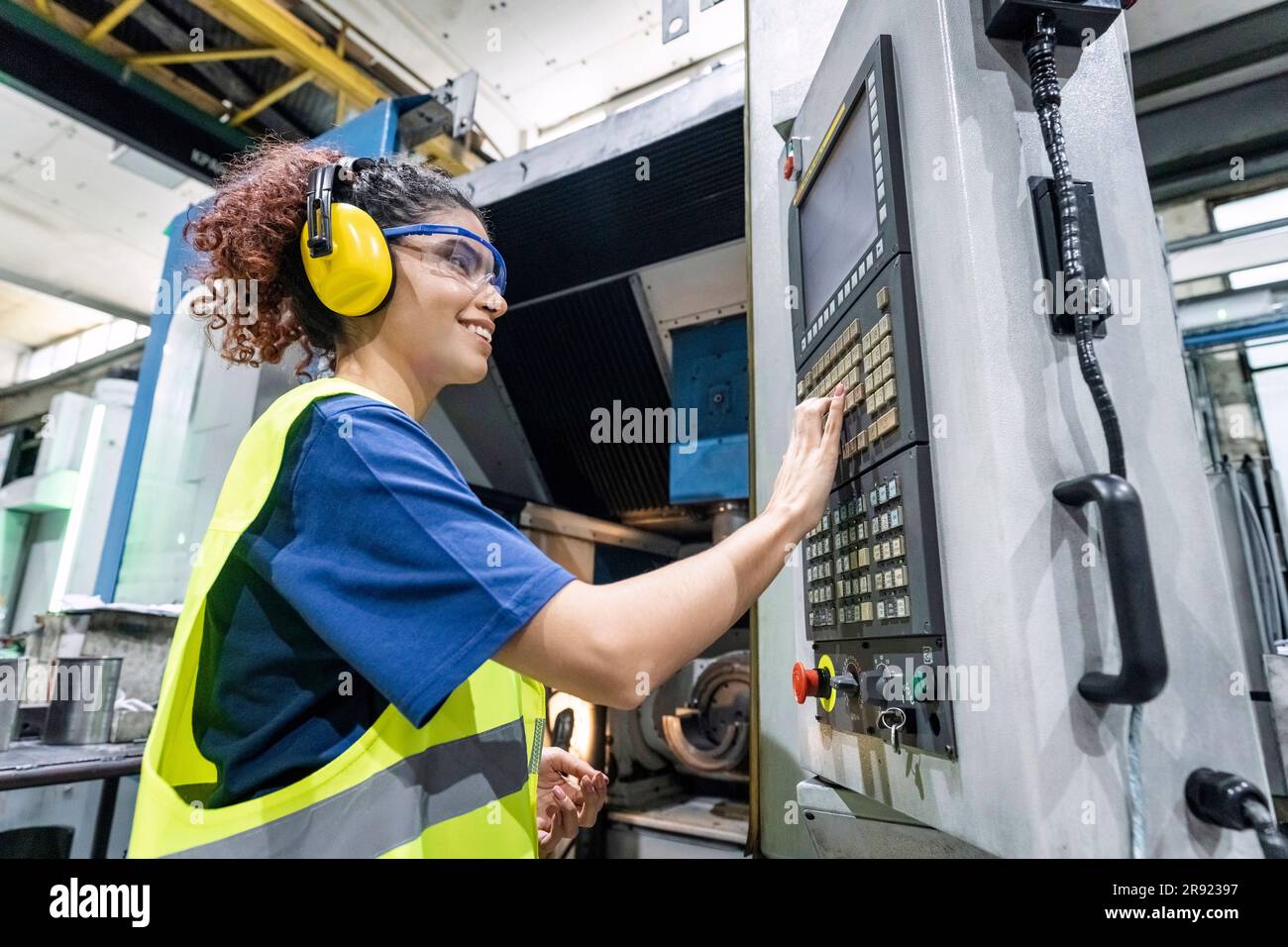 Protective clothing and cnc machine hi-res stock photography and images ...