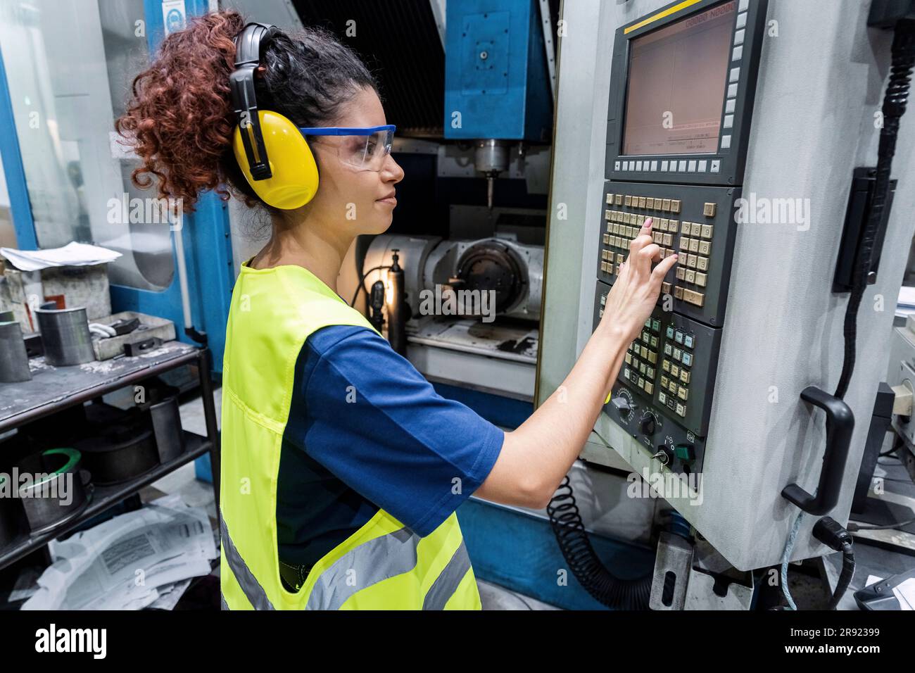 Protective clothing and cnc machine hi-res stock photography and images ...
