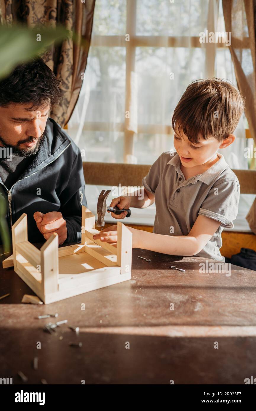 Father teaching son hammer hi-res stock photography and images - Alamy