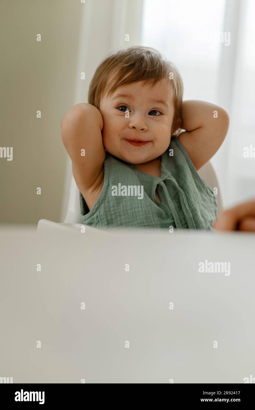 Baby girl hands behind head hi-res stock photography and images - Alamy