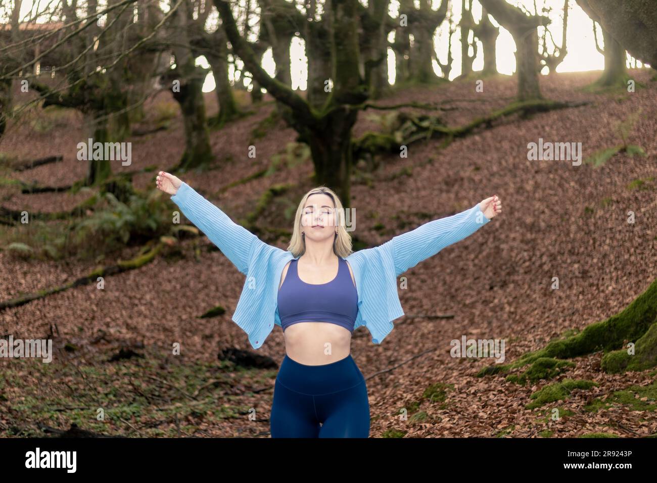 Blonde Beauty Embracing Nature's Serenity: Deep Breath in the Beech ...