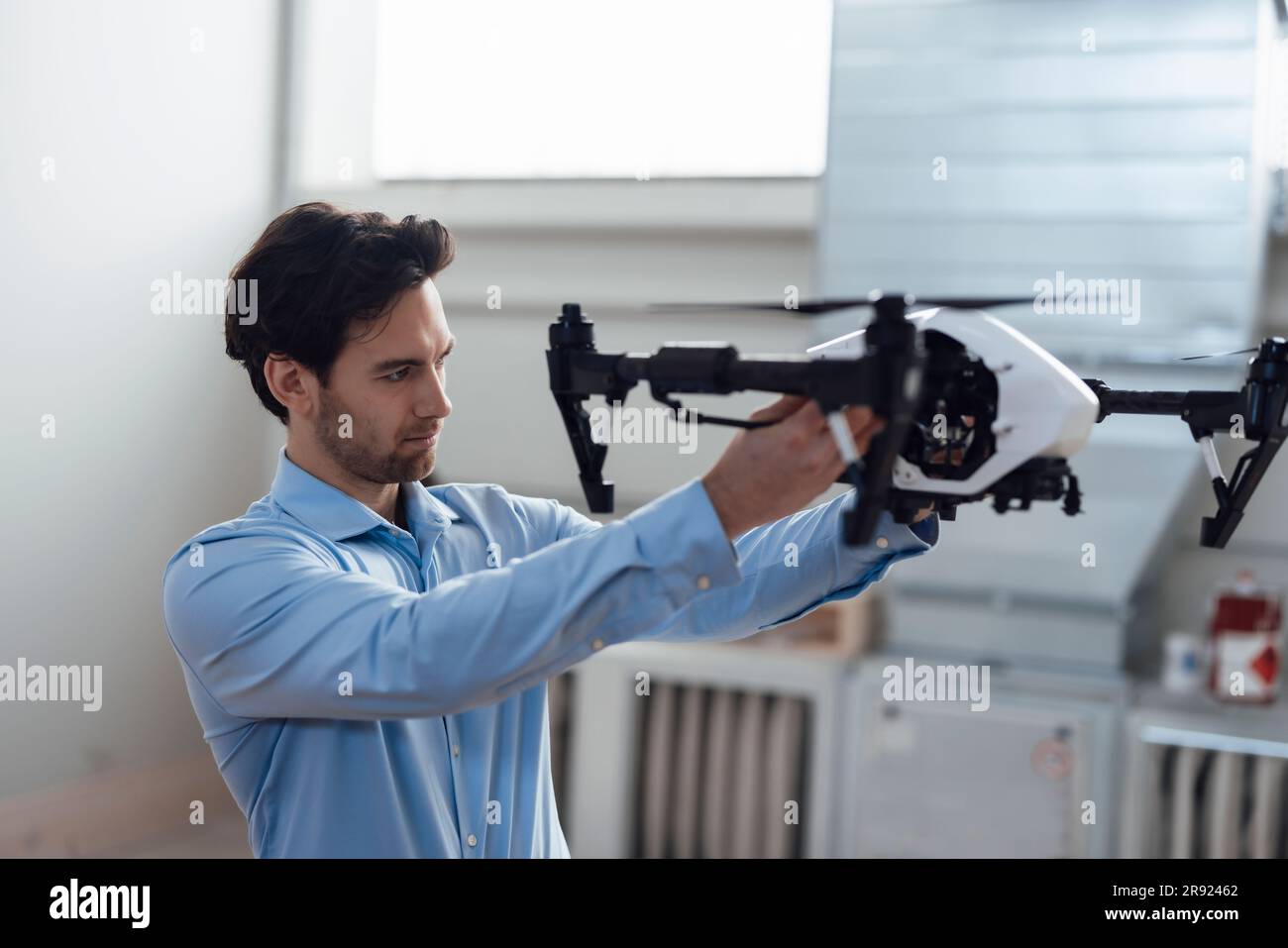 Engineer examining drone at industry Stock Photo - Alamy