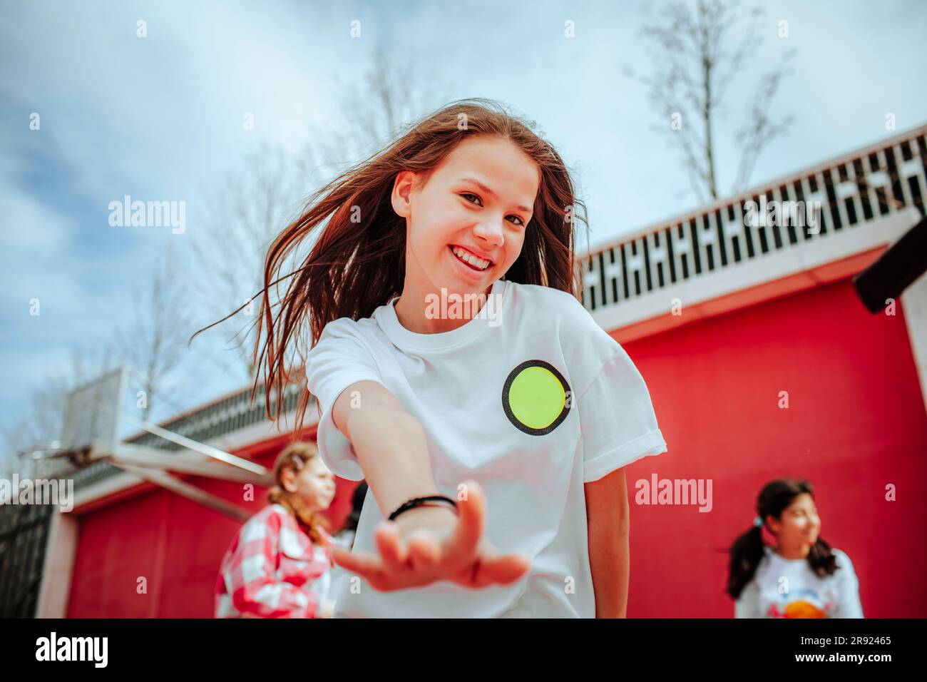 Smiling teenage girl dancing at playground Stock Photo - Alamy