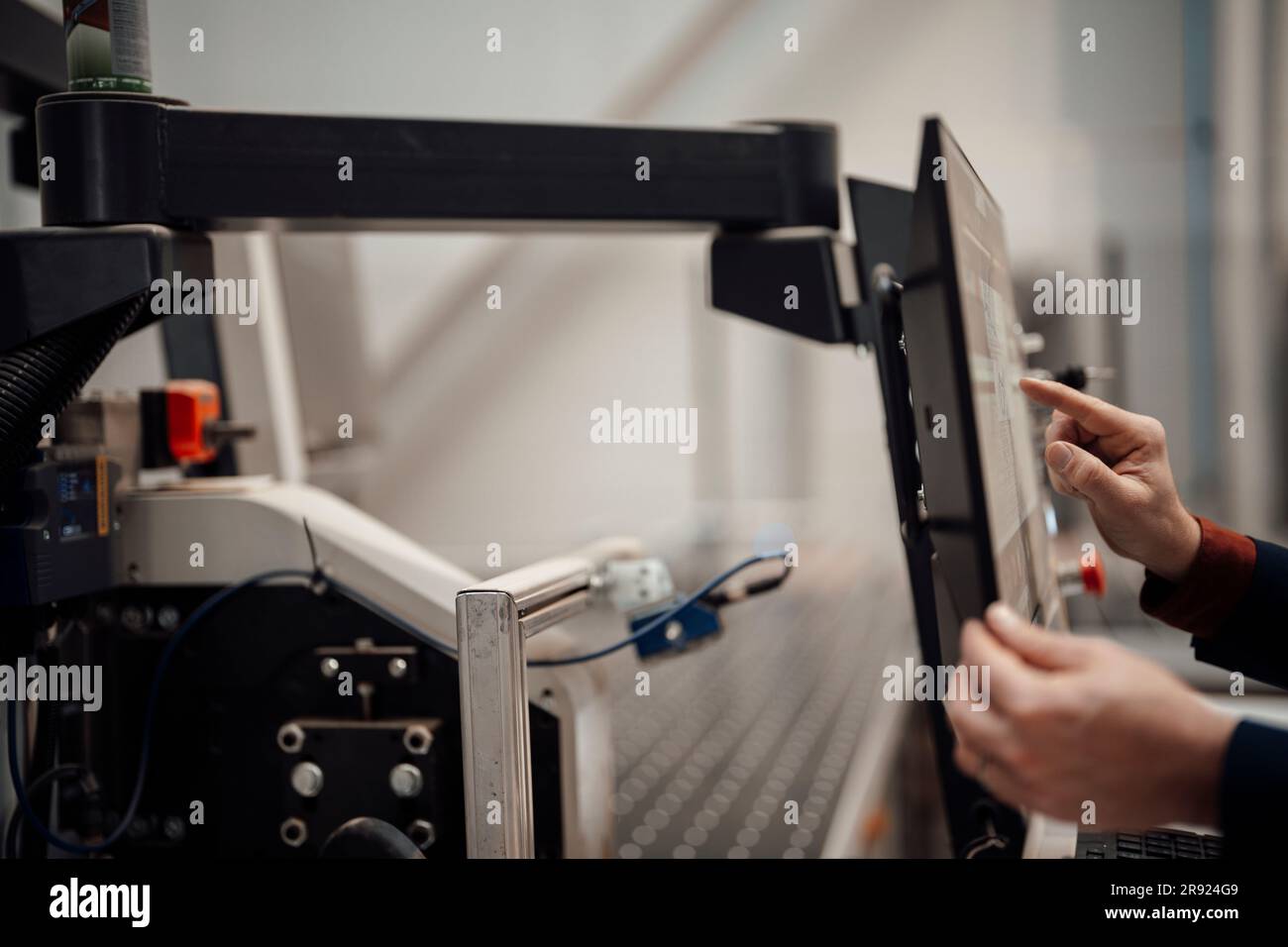 Hands man operating machine hi-res stock photography and images - Alamy