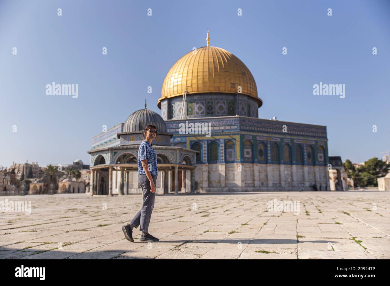 Young woman walking in front of Al-aqsa mosque on sunny day, Jerusalem ...