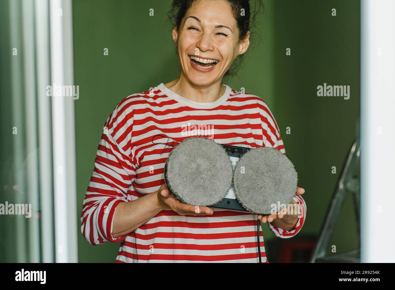 Mature woman cleaning windows hi-res stock photography and images - Alamy
