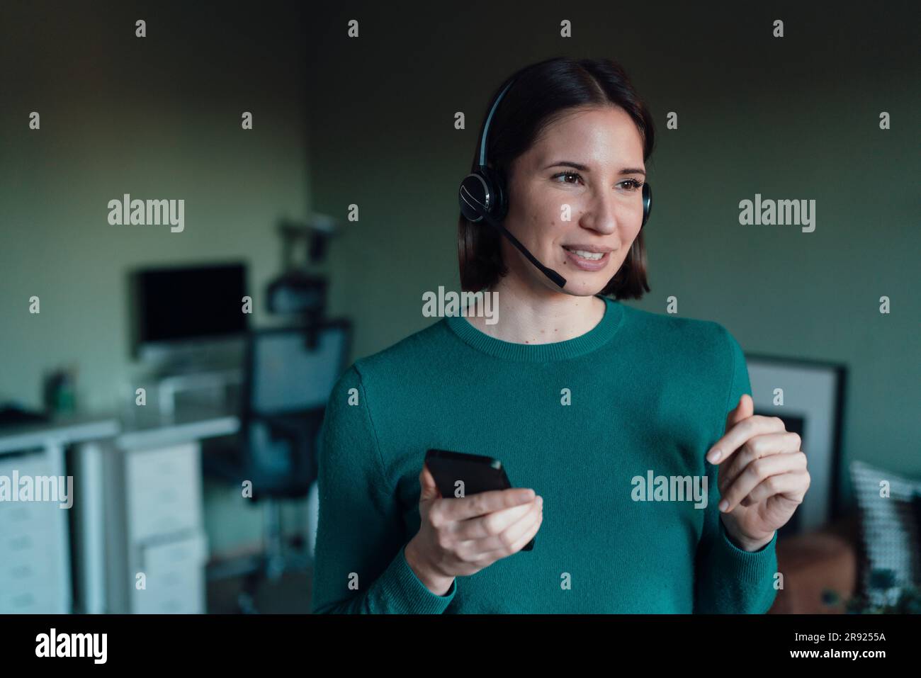 Woman talking into microphone hi-res stock photography and images - Alamy