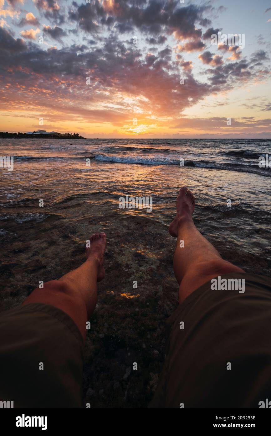 Man relaxing on beach hi-res stock photography and images - Alamy