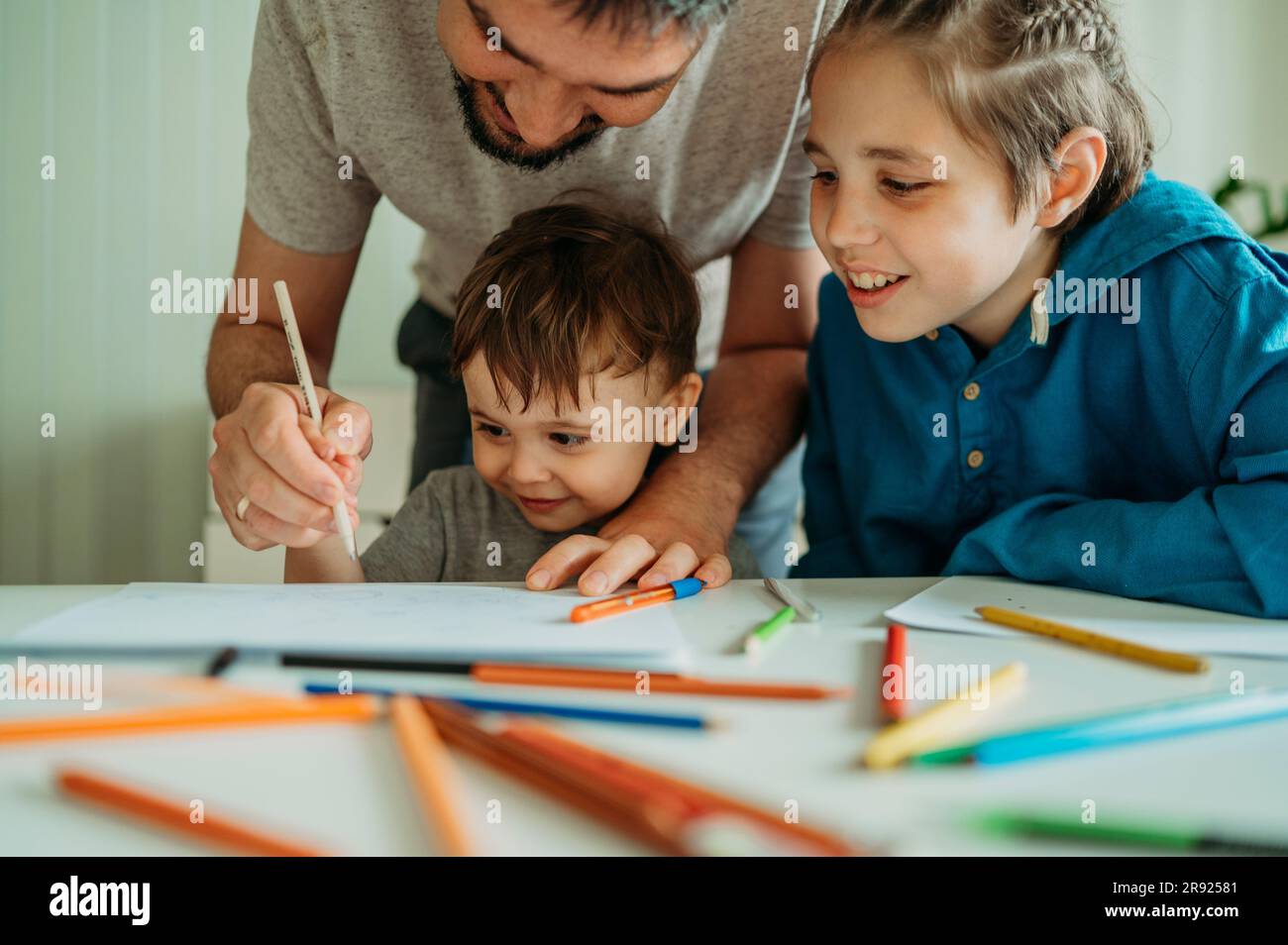Child using pencil hi-res stock photography and images - Alamy