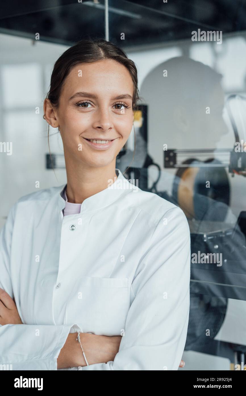 Smiling young scientists in hi-res stock photography and images - Alamy