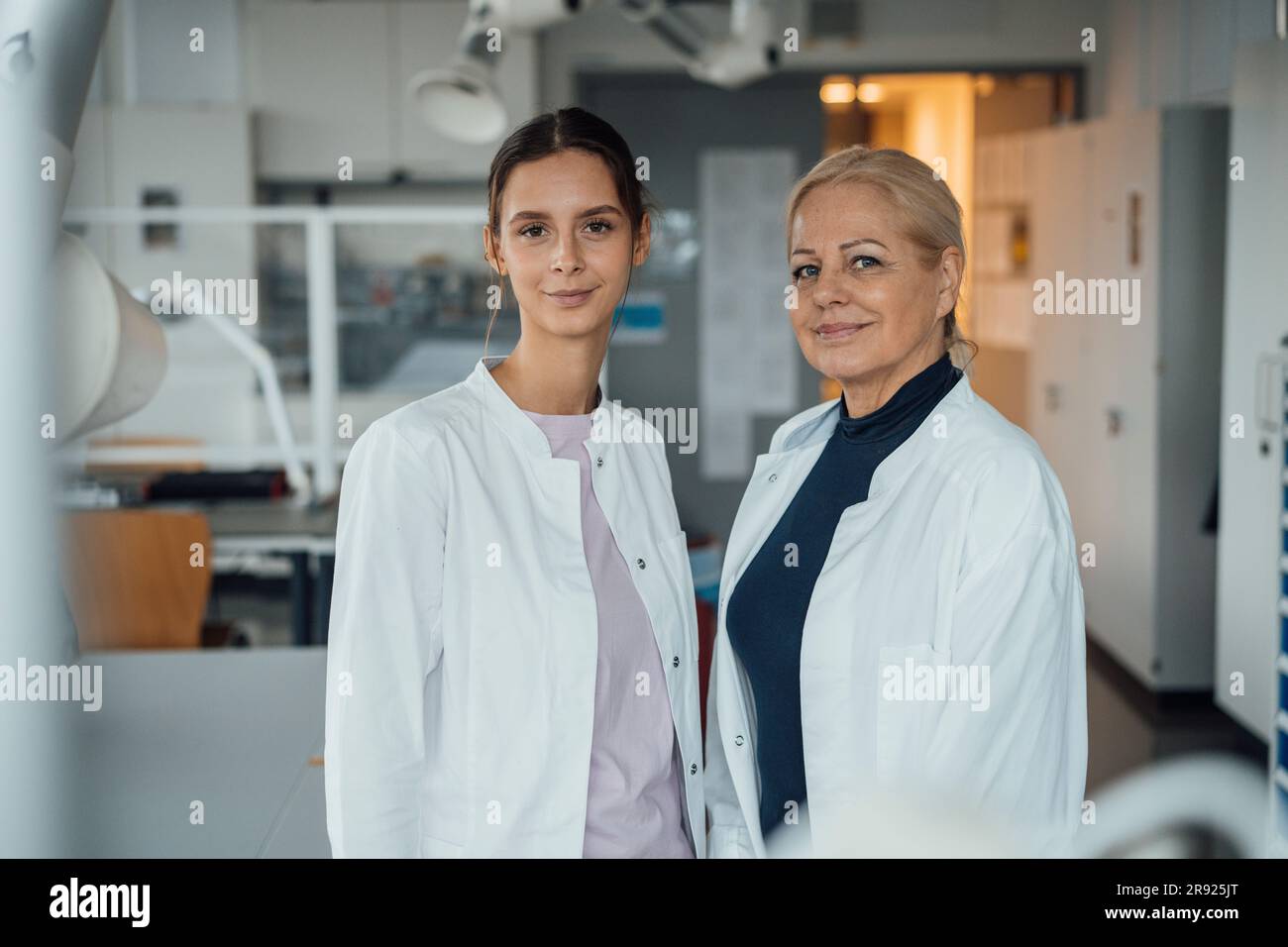 Smiling young scientists in hi-res stock photography and images - Alamy