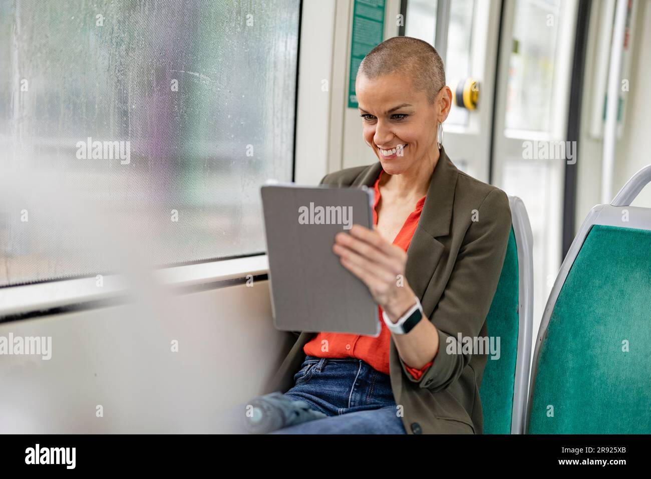 Female commuter using digital tablet hi-res stock photography and ...