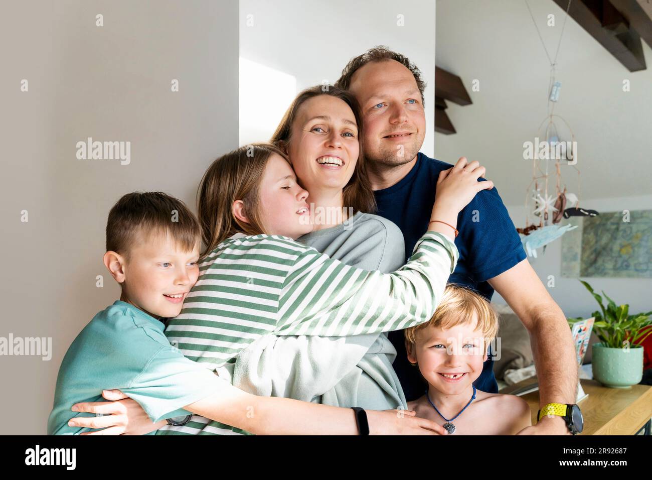 Happy family home together smiling hi-res stock photography and images ...