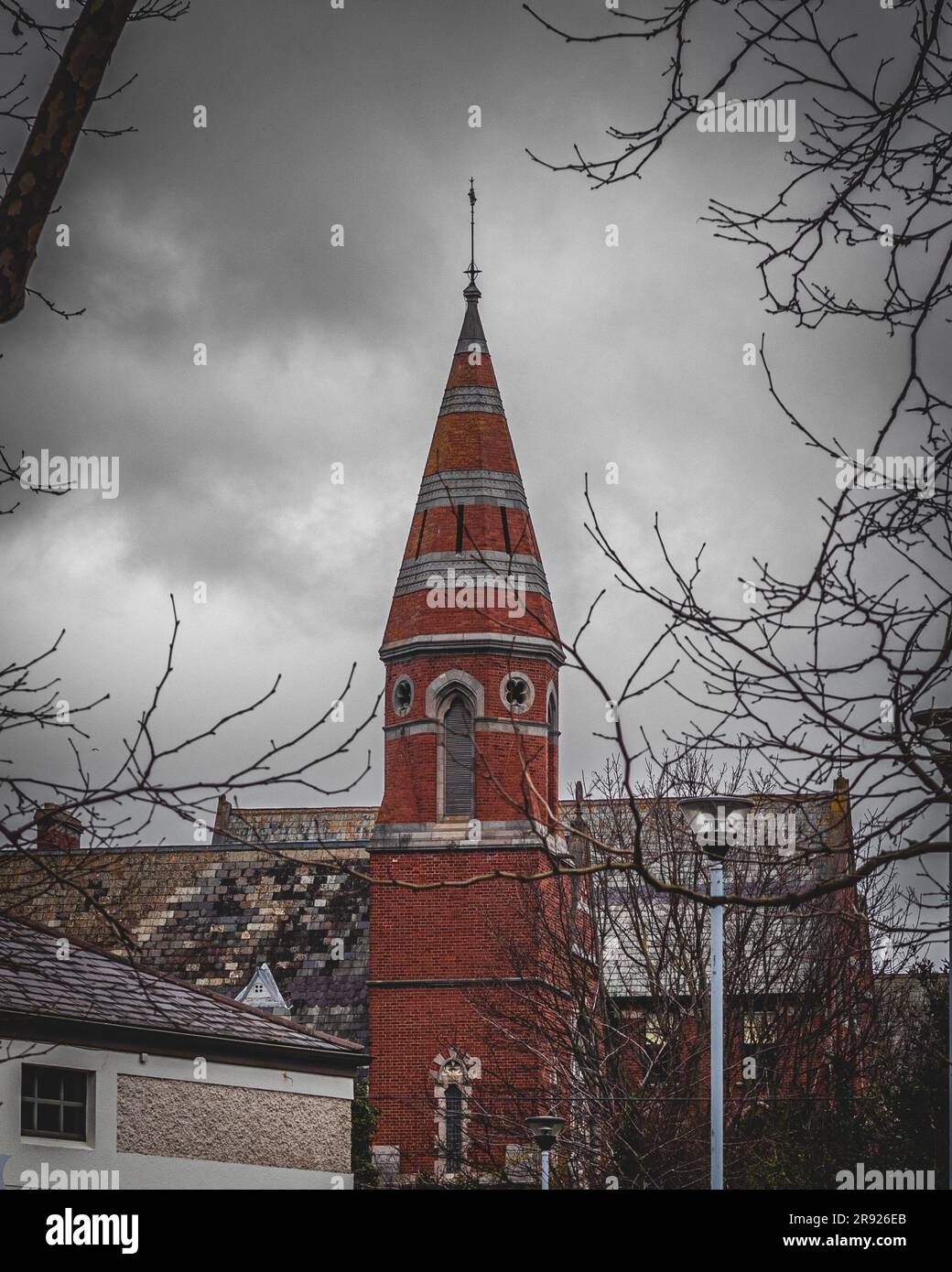 This image shows a tall, majestic building with a spire on the top in ...