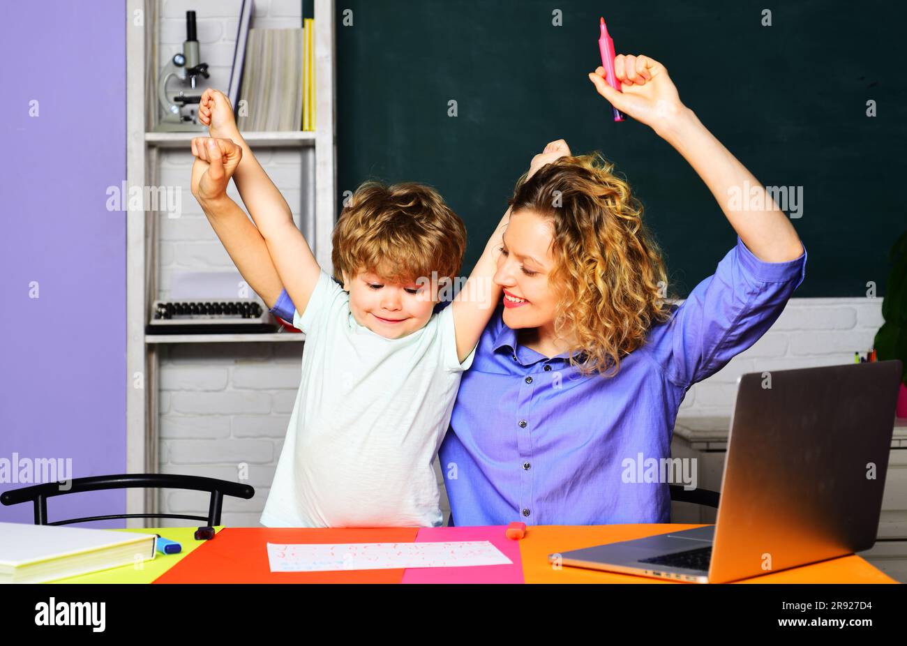 Back to school. Knowledge day. Female teacher preparing kid for school ...