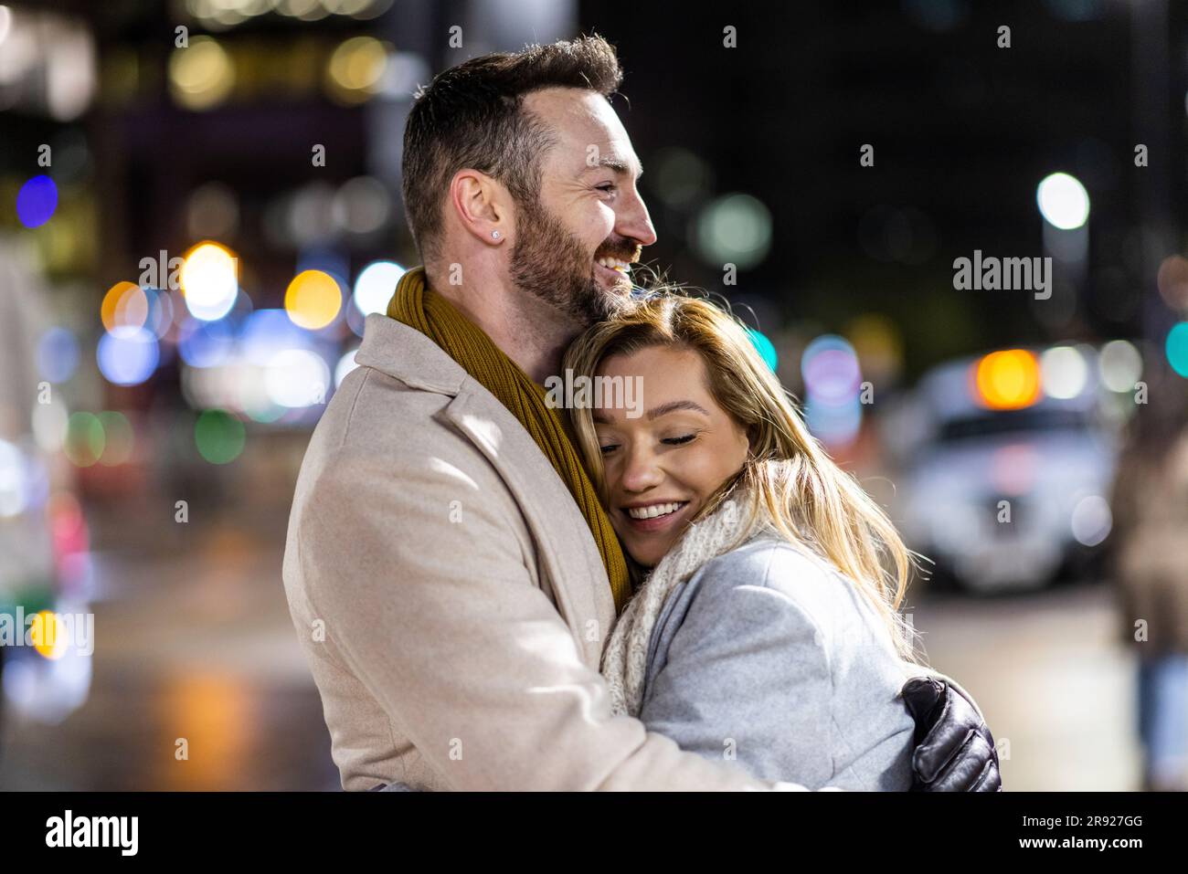 Happy loving couple hugging each other Stock Photo - Alamy