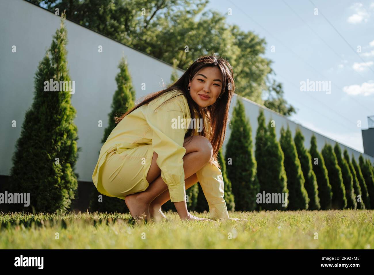 Full length portrait woman crouching hi-res stock photography and ...