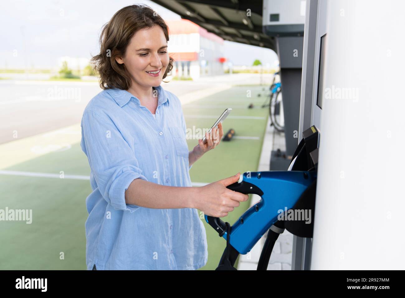 Woman plugging smartphone power hi-res stock photography and images - Alamy