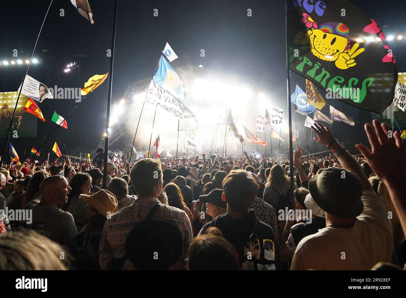 Crowds watch the Arctic Monkeys performing at the Glastonbury Festival ...