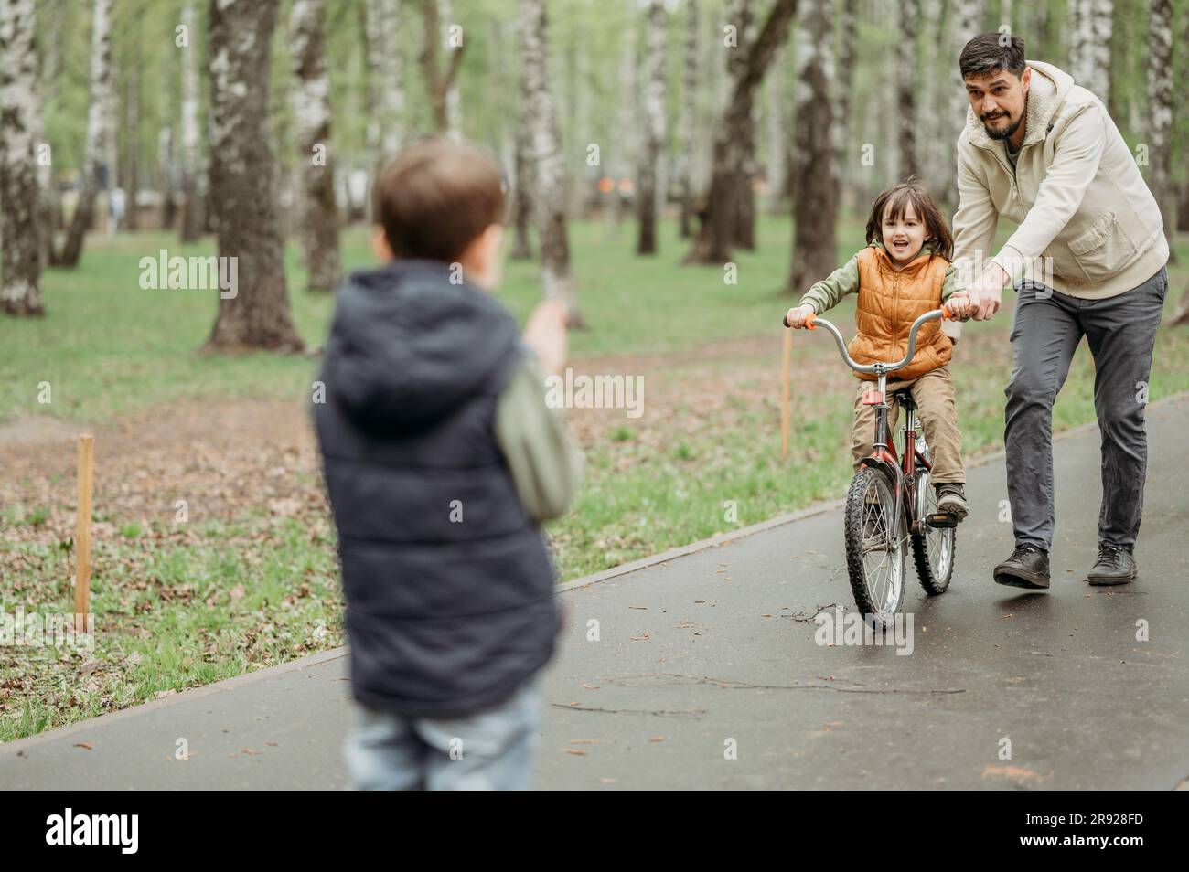Parents supporting children hi-res stock photography and images - Alamy